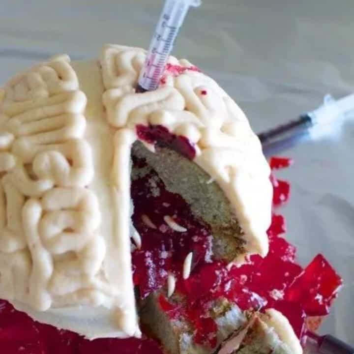 Brain pinata cake filled with bloody maggots - Halloween dessert